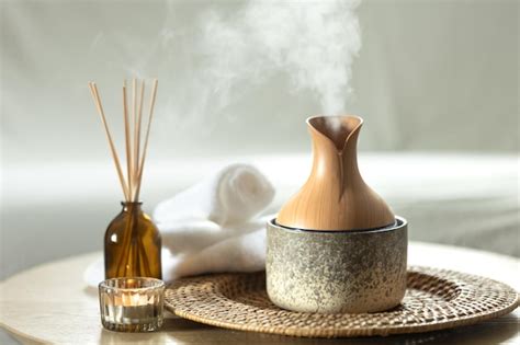 Free Photo Aroma Oil Diffuser Lamp With The Sticks Perfume And Candle