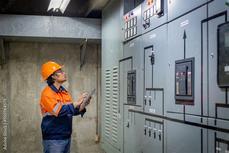 The Engineer Checking And Inspecting At MDB Panel He Working With Electric Switchboard To Check