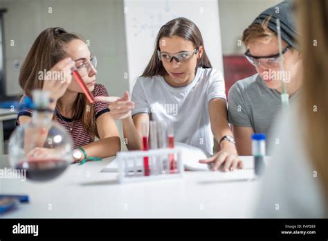 Babes In Science Class Experimenting With Test Tubes Stock Photo Alamy