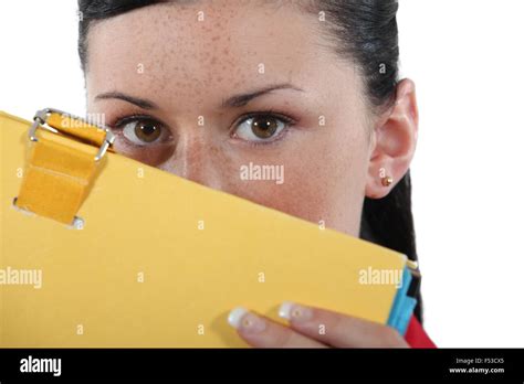 Woman Hiding Behind Folder Stock Photo Alamy