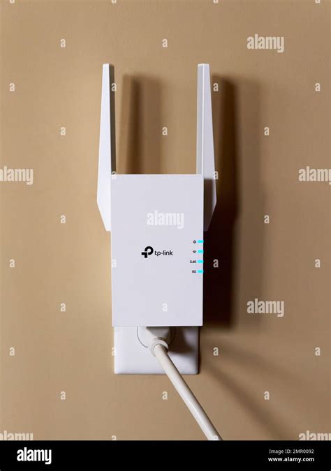 Tp Link Wi Fi Range Extender New Wifi Technology Plugged In To A Wall Socket Stock Photo Alamy