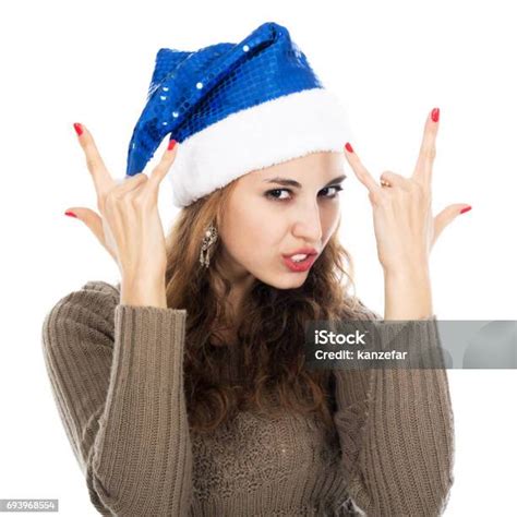 에 산타 모자 염소 바위앤롤 기호를 보여주는 여자 가리키기에 대한 스톡 사진 및 기타 이미지 가리키기 개념 거절 Istock