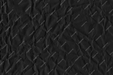 검은 구겨진 종이 질감 배경 프리미엄 사진