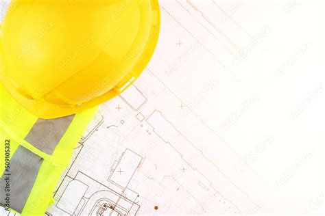 Autocad Drawing Architecture And Construction Builder S Hard Hat And Safety Vest On