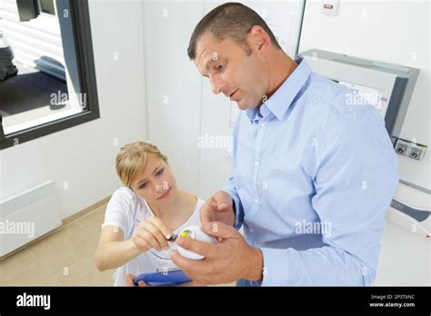 Inspector Testing Appliances In Business Premises Stock Photo Alamy
