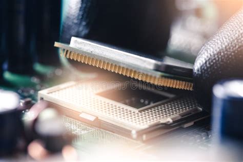 The Technician Is Laying A CPU On The Motherboard Socket Stock Photo Image Of Industry Access