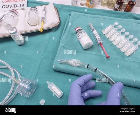 Nurse Refilling Medication Solution Nebulizer Container Along With