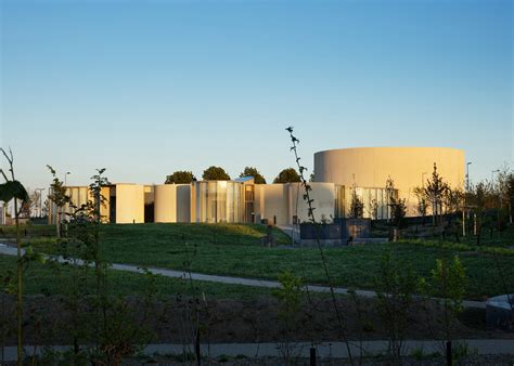 Plan 01s Crematorium Is Covered In Ribbed Concrete And Glass