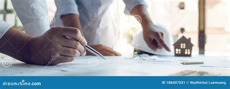 Engineers Are Helping To Design Work On Blueprints And Collaborate On Structural Analyzing Of