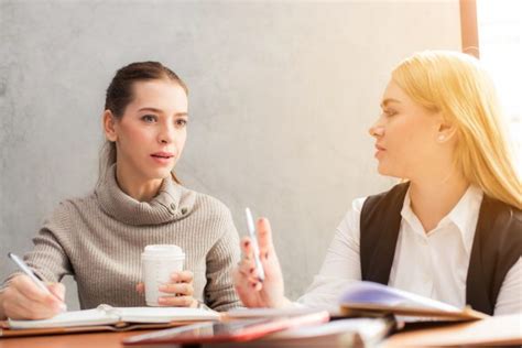 Person Asking A Question To Another Person