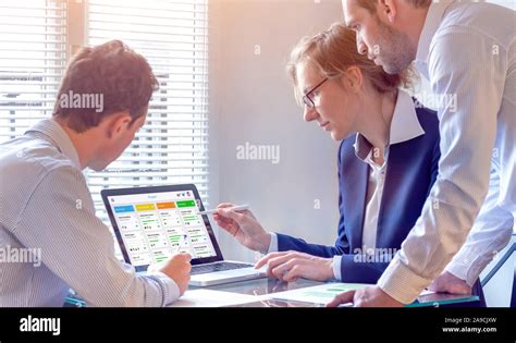 daily team meeting around agile product development board with scrum or
