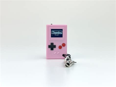 Thumby The Playable And Programmable Keychain Pink Oz Robotics
