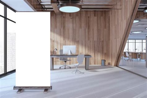 동시대의 목조 및 콘크리트 사무실 인테리어는 빈 모형으로 롤 업 배너 가구 나무 바닥 및 도시 전망과 빛을 가진 모형 창문 3d 렌더링 프리미엄 사진