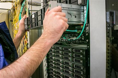System Administrators To The Rescue Two It Technicians Using A Computer While Working In A Data