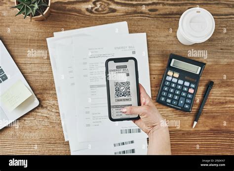 Woman Paying For Energy Scanning Qr Code From Bill Making Payment