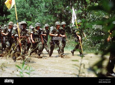 Fully Equipped Recruits From The Woman Recruit Training Command March Into The Field For