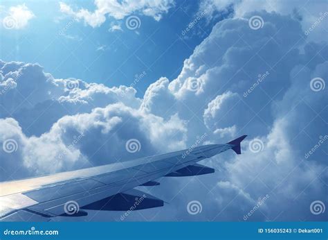 View Of The Blue Sky And Clouds On The Airplain From Window Wing Of