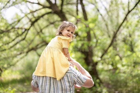 Father With His Daughter Having Fun Outside In Forest Stock Image