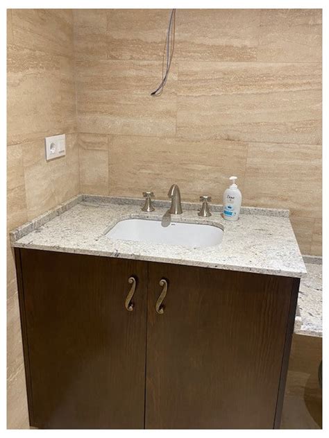 how can i correct clashing counter top and travertine walls