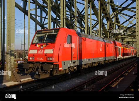 A Passenger Service Hauled By A Class 146 Locomotive Crosses The Rhine Hohenzollern Bridge In A Passenger Service Hauled By A Class 146 Locomotive Crosses The Rhine Hohenzollern Bridge In