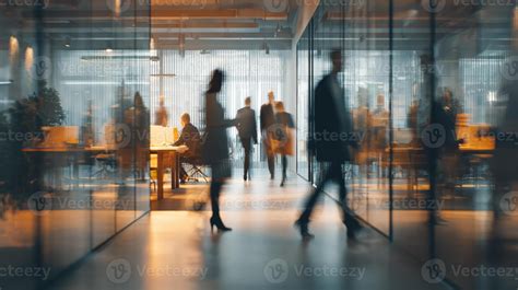 Blurred Motion Of Business Professionals In Modern Office Reflecting