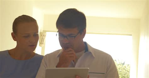 Business People With Tablet Pc Walking Along The Passage 29168737 Stock Video At Vecteezy