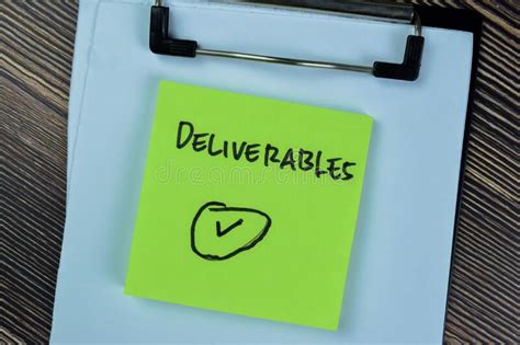 Concept Of Deliverables Write On Sticky Notes Isolated On Wooden Table Stock Image Image Of