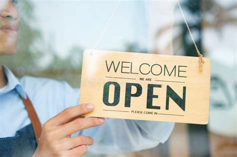 Small Business Owner Opening Shop To Welcome Customers Stock Photo ...