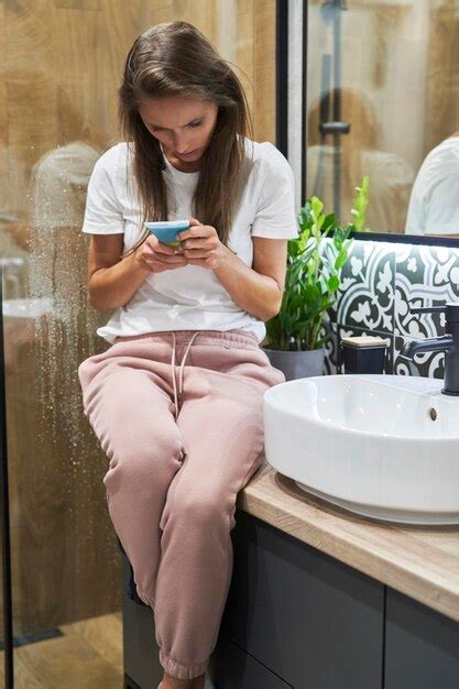 Premium Photo Woman Checking Label Of The Cosmetic