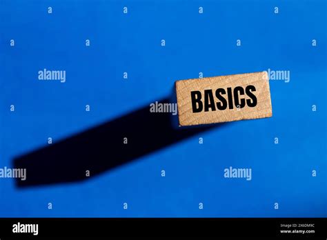 Basics Word Written On Wooden Block With Blue Background Conceptual