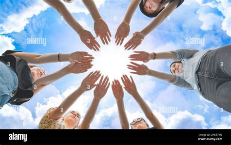 Girlfriends Join The Palms Of Their Hands In The Center Making A Circle