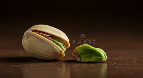 Close Up Shot Of A Pistachio Nut And Shelled Nut On Wooden Surface Generated Using Ai Stock