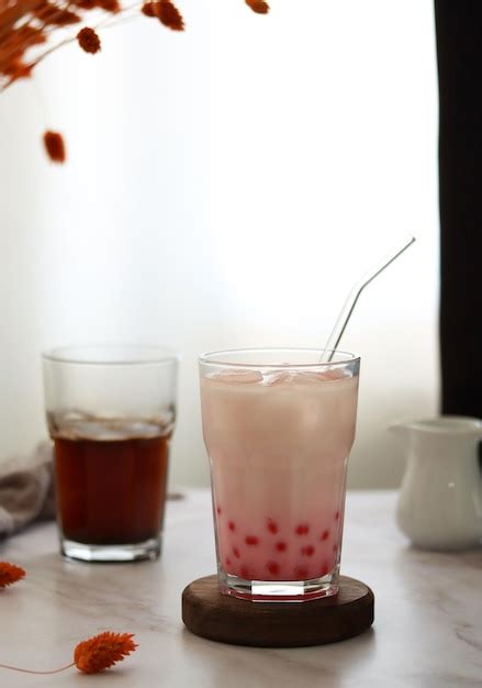 Premium Photo A Glass Of Bubble Tea With A Straw