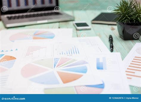 Photo Diagrams Graphs And Numerals In The Table On The Paper Stock Photo Image Of Document