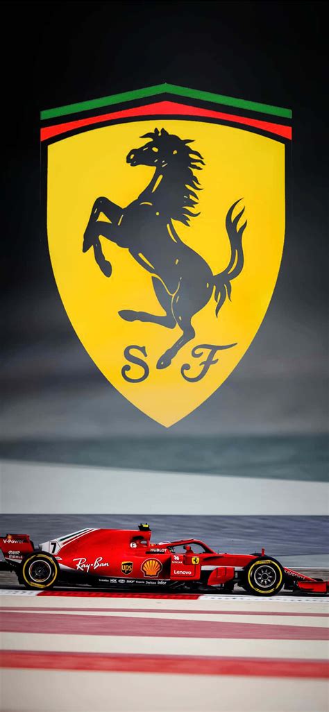 Download Ferrari F1 Racing Under Iconic Logo Wallpaper