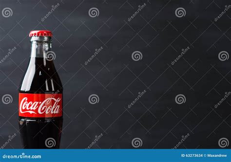 Classic Bottle Of Coca Cola On Rustic Background Editorial Stock Image