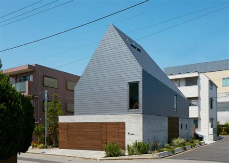 Kentaro Ishida Adds Stripy Steel Skin To Asymmetric House In Japan