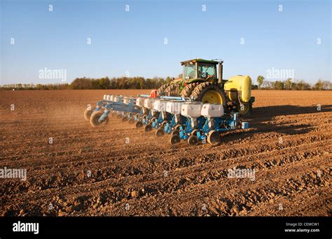 Agriculture A John Deere Tractor And Monosem 24 Twin Row Planter