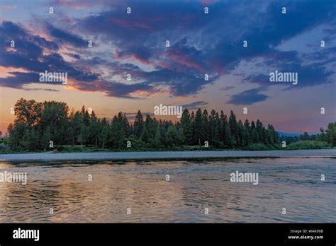 Sunset Clouds Over The Flathead River In Columbia Falls Montana Usa
