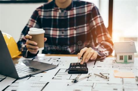 Civil Engineer Or Architect Business Useing Calculator About Calculate The Cost With For Working