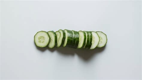 Cucumber Sliced Isolated On White Premium Ai Generated Image