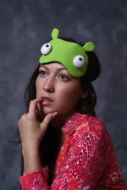Premium Photo Thoughtful Young Woman Wearing Eye Mask
