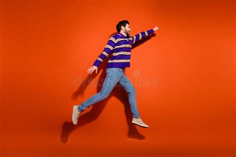 Full Size Photo Of Nice Young Male Flying Superhero Wear Trendy Striped Violet Outfit Isolated