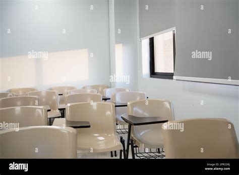 Empty Classes At University Or School With Chairs And Side Tables The