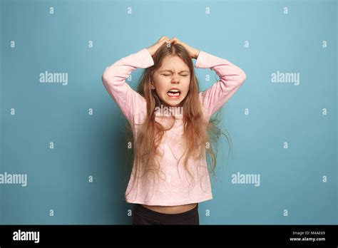 The Cry Teen Girl On A Blue Background Facial Expressions And People
