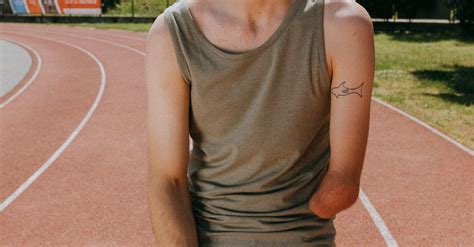 Portrait Of Man With A Missing Arm On A Running Sports Track · Free