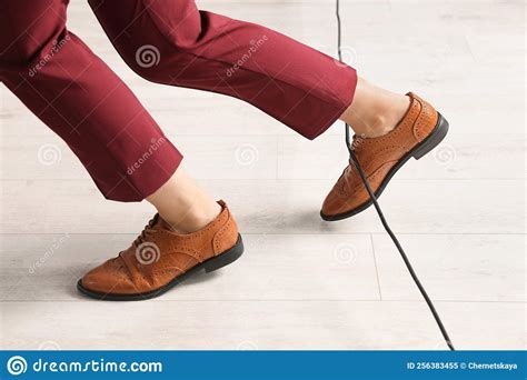 Woman Tripping Over Cable In Office Closeup Stock Image Image Of