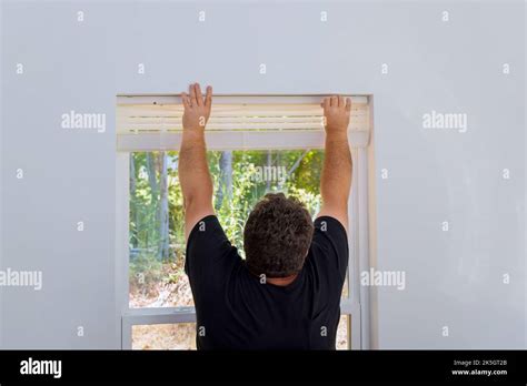 Installing Window Blinds On A Newly Constructed Home By Contractor