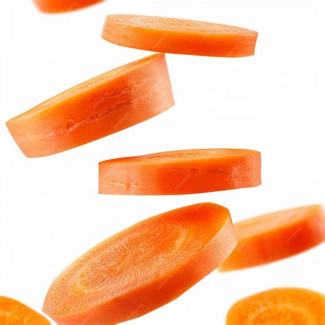 Carrot Slices Levitate Isolated On White Background Premium Ai Generated Image