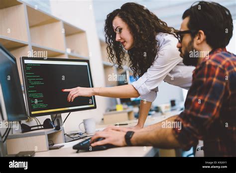 software engineers working on project and programming in company stock